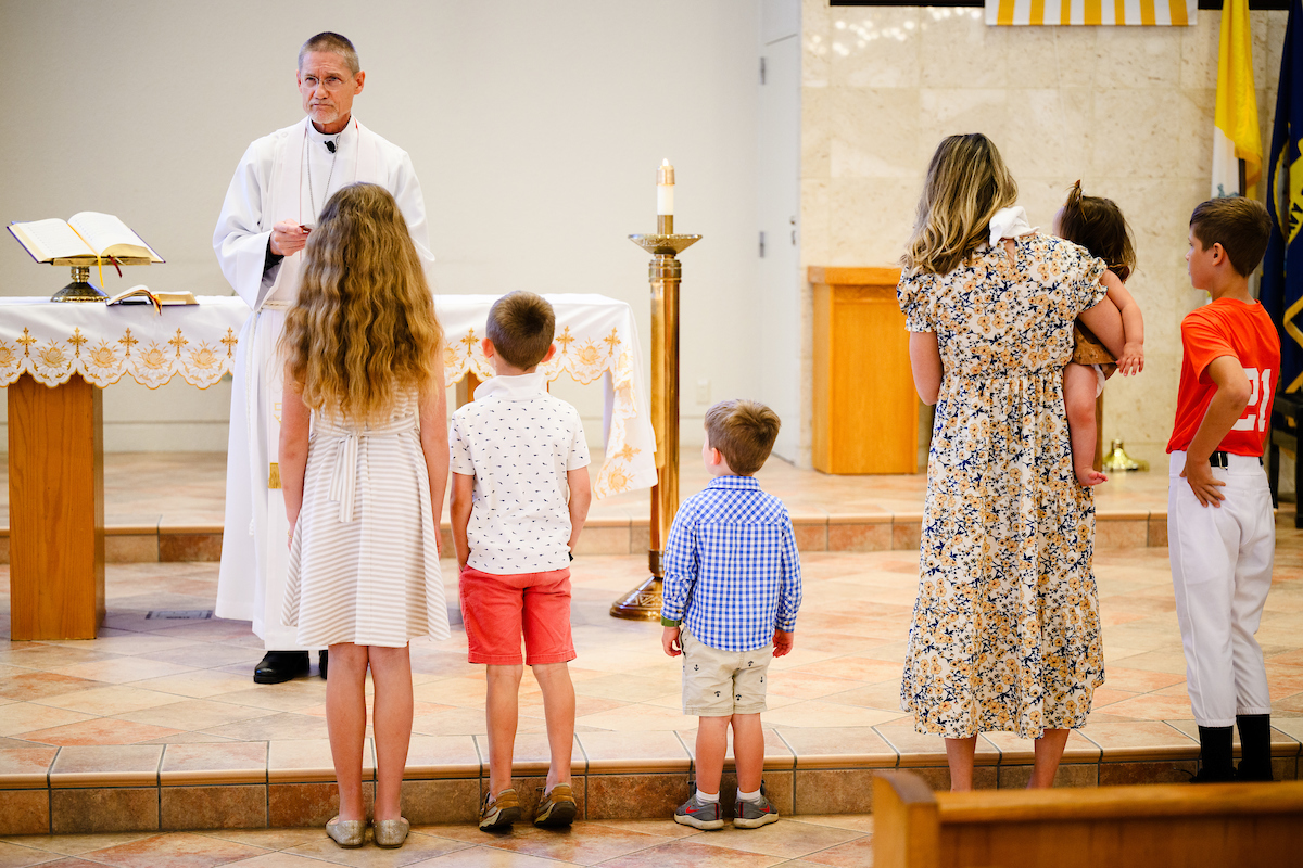 LCMS missionary Rev. Dr. Daniel Jastram distributes the Sacrament ...